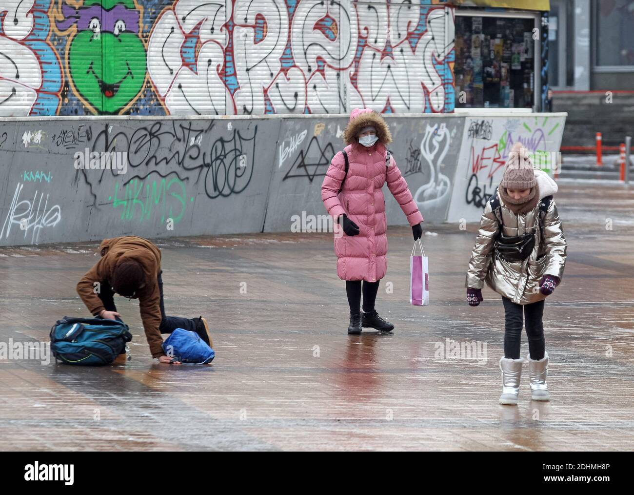 Kiev, Ukraine. 11th Dec, 2020. A boy fell while walking on a slippery ...