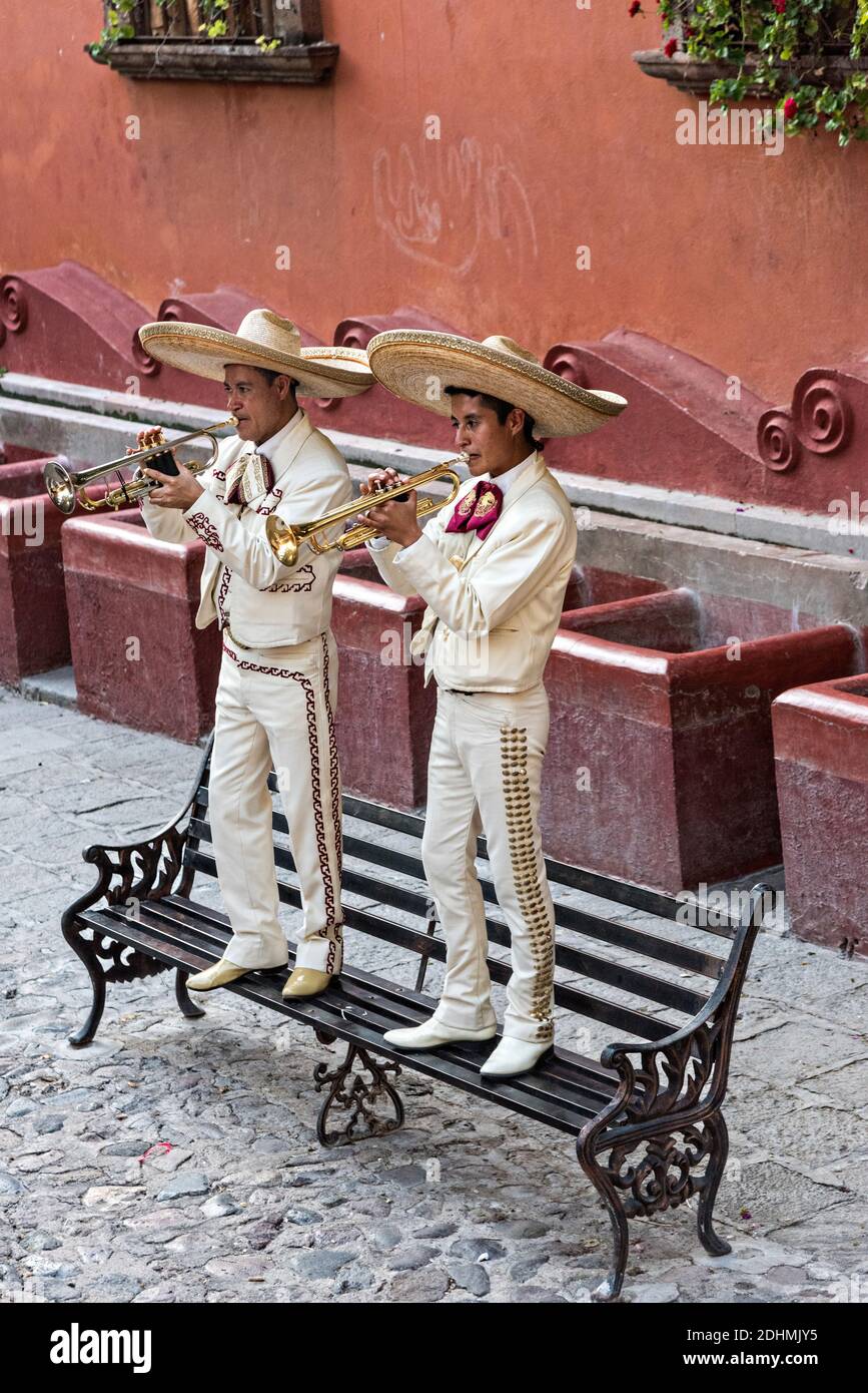 A traditional Mexican mariachi band plays during a wedding celebration ...