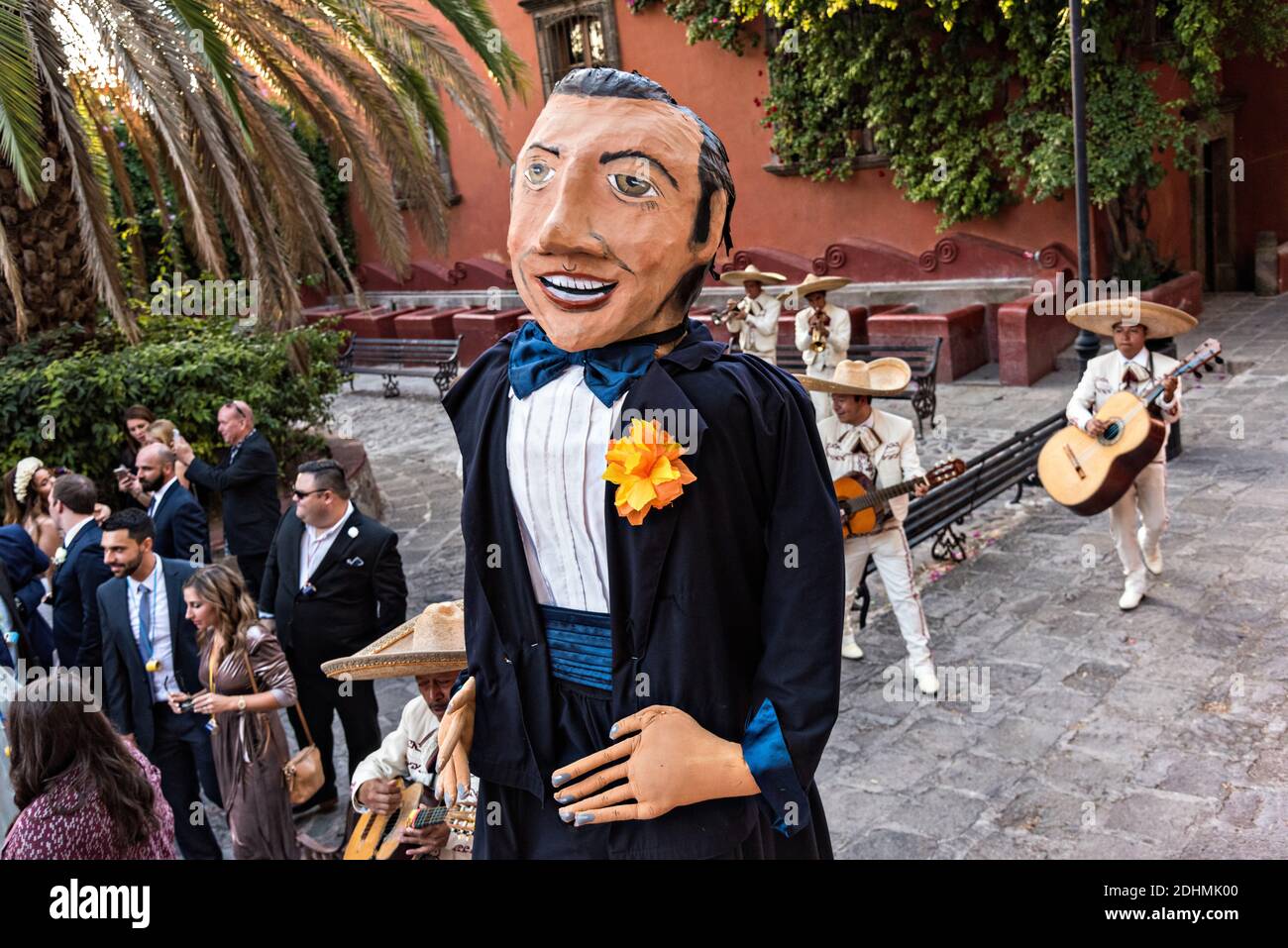 A traditional Mexican mariachi band plays as giant puppets called ...