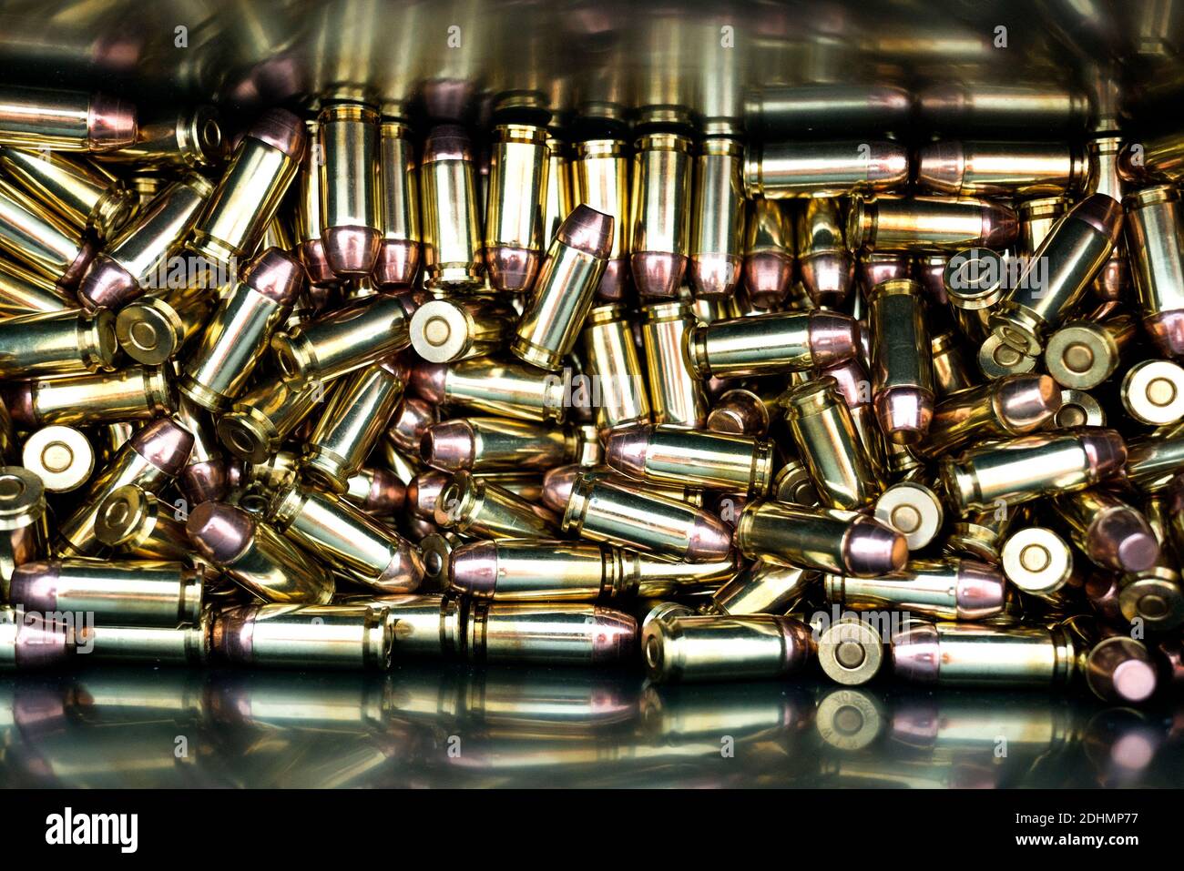 Pile of ammunition for a hand gun - Shooting - Metal - Copper Stock ...