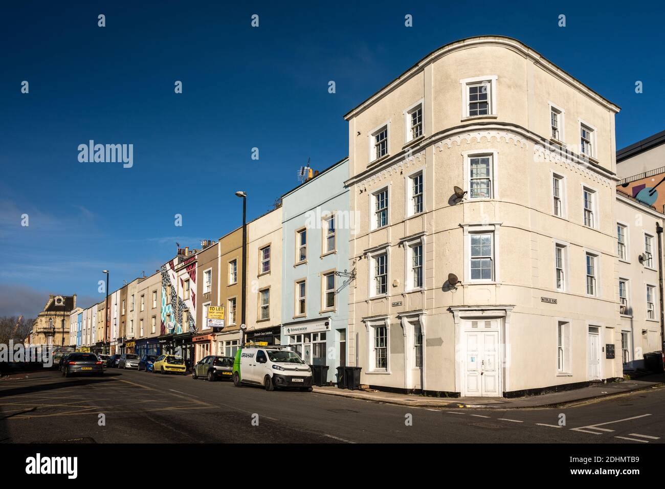 Sun shines on traditional medium-density terraced housing and small ...