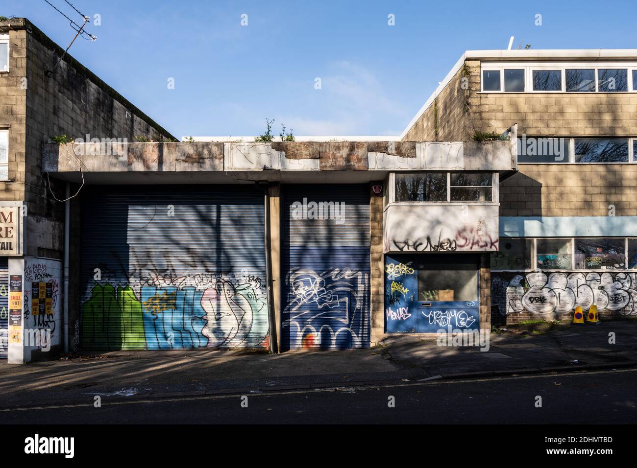 A showroom and office building stand abandoned and defaced on Unity ...
