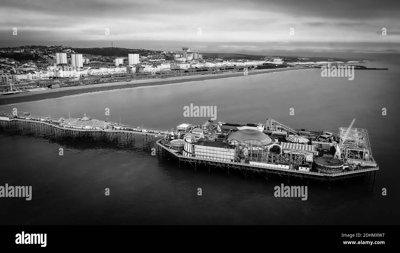 Brighton Pier from above - aerial view over Brighton Beach in black and ...
