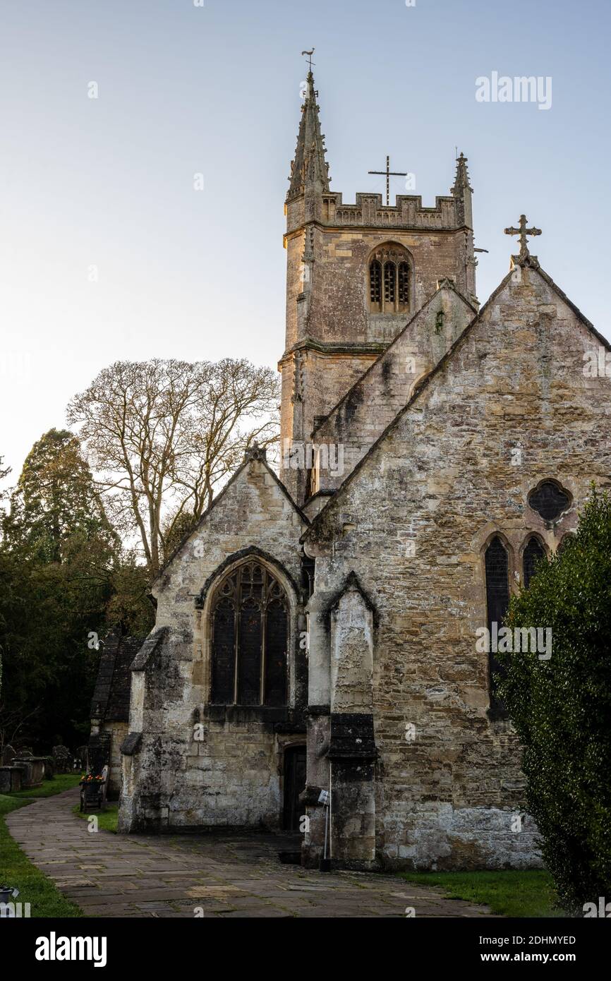 The traditional parish church of St Andrew in Castle Combe village in ...