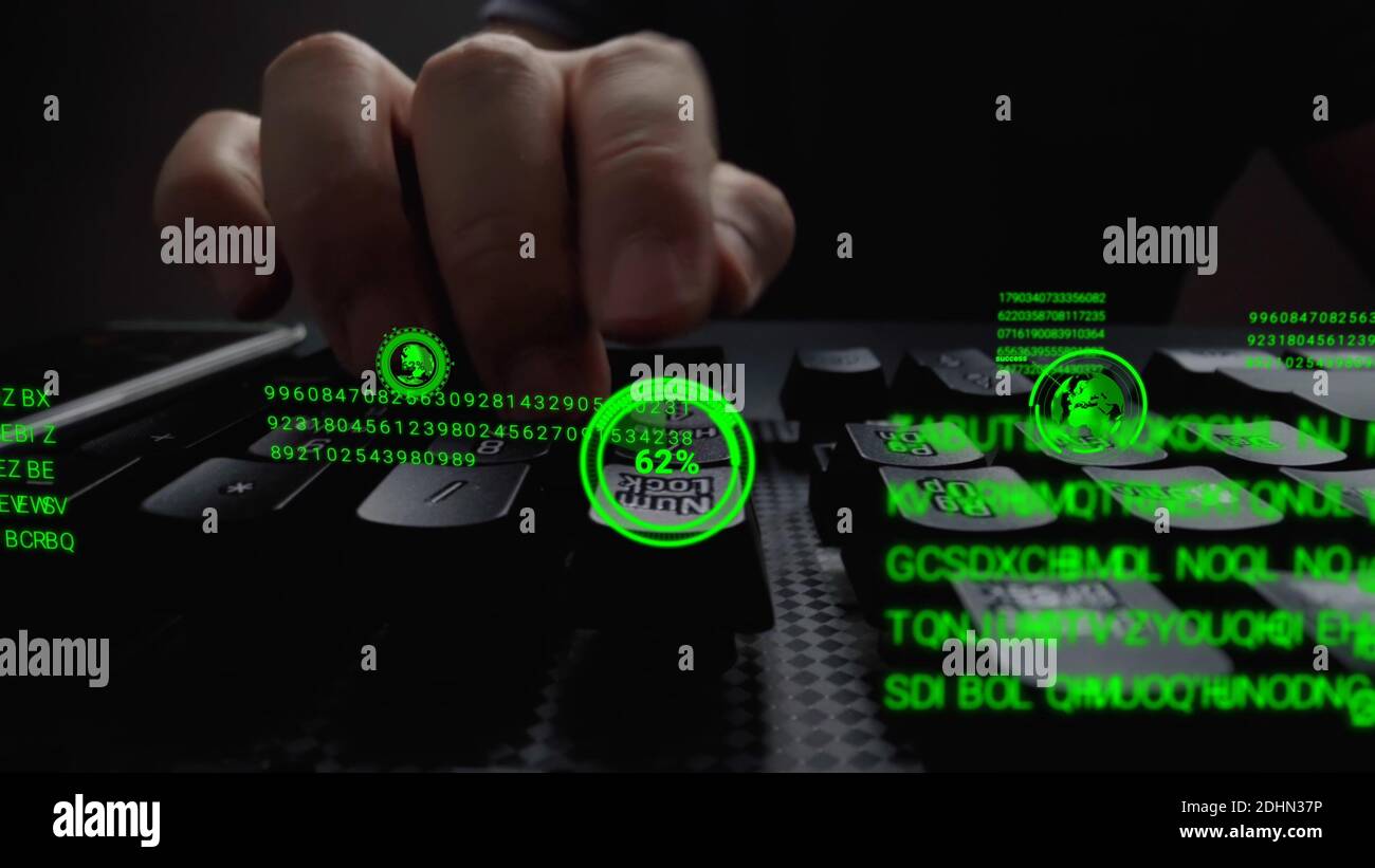 Man working on laptop computer keyboard with graphic user interface GUI ...