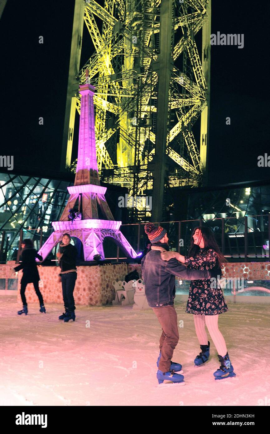Parisians ice skating on an ice rink installed on the first floor of ...