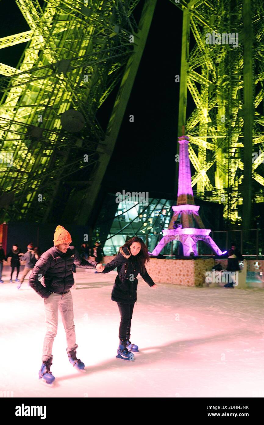 Parisians ice skating on an ice rink installed on the first floor of ...