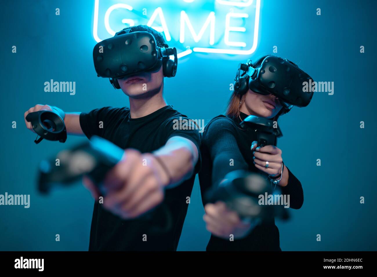 Cyber battle in VR reality. Playing in a neon room Stock Photo - Alamy
