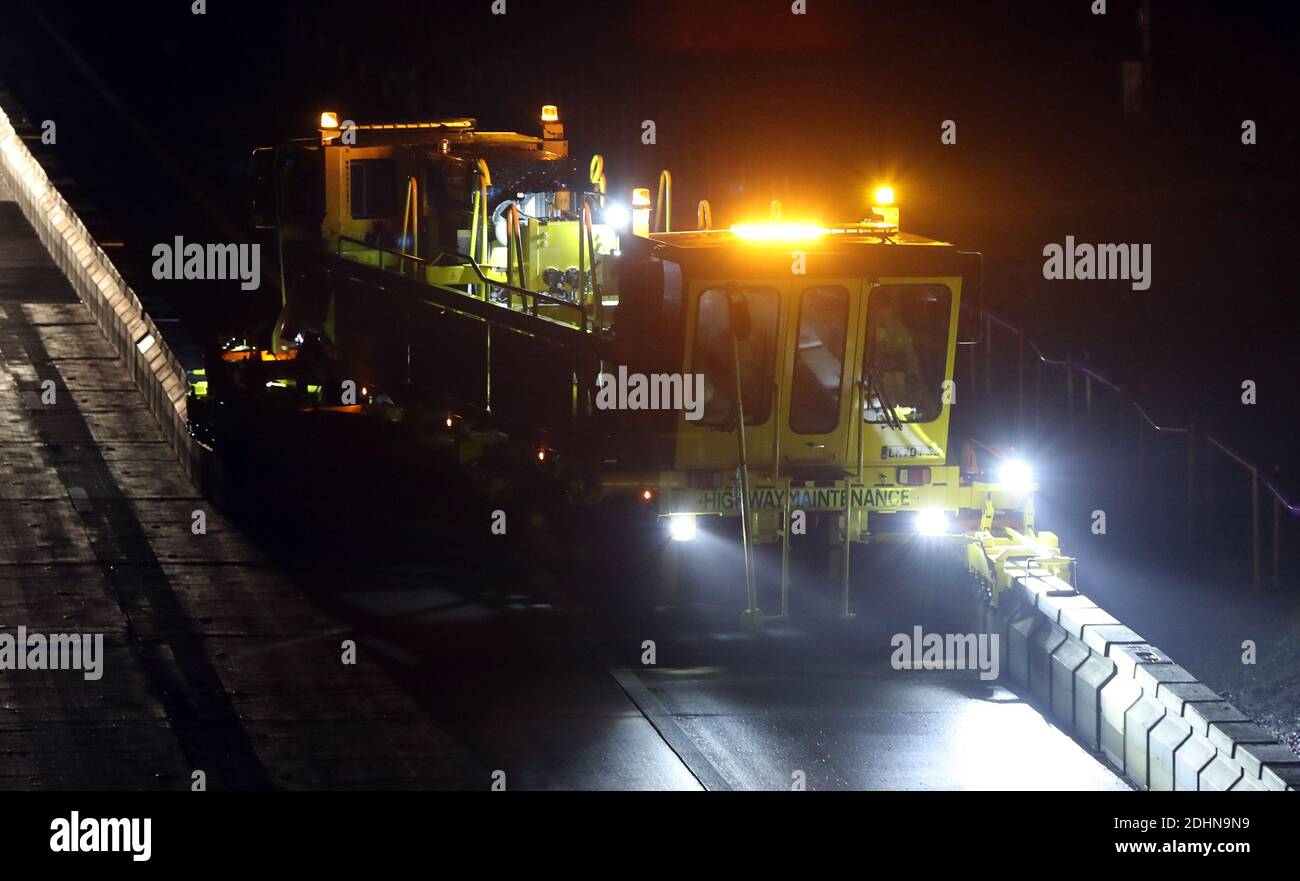 A moveable barrier system is lifted into place on a section of the M20 ...