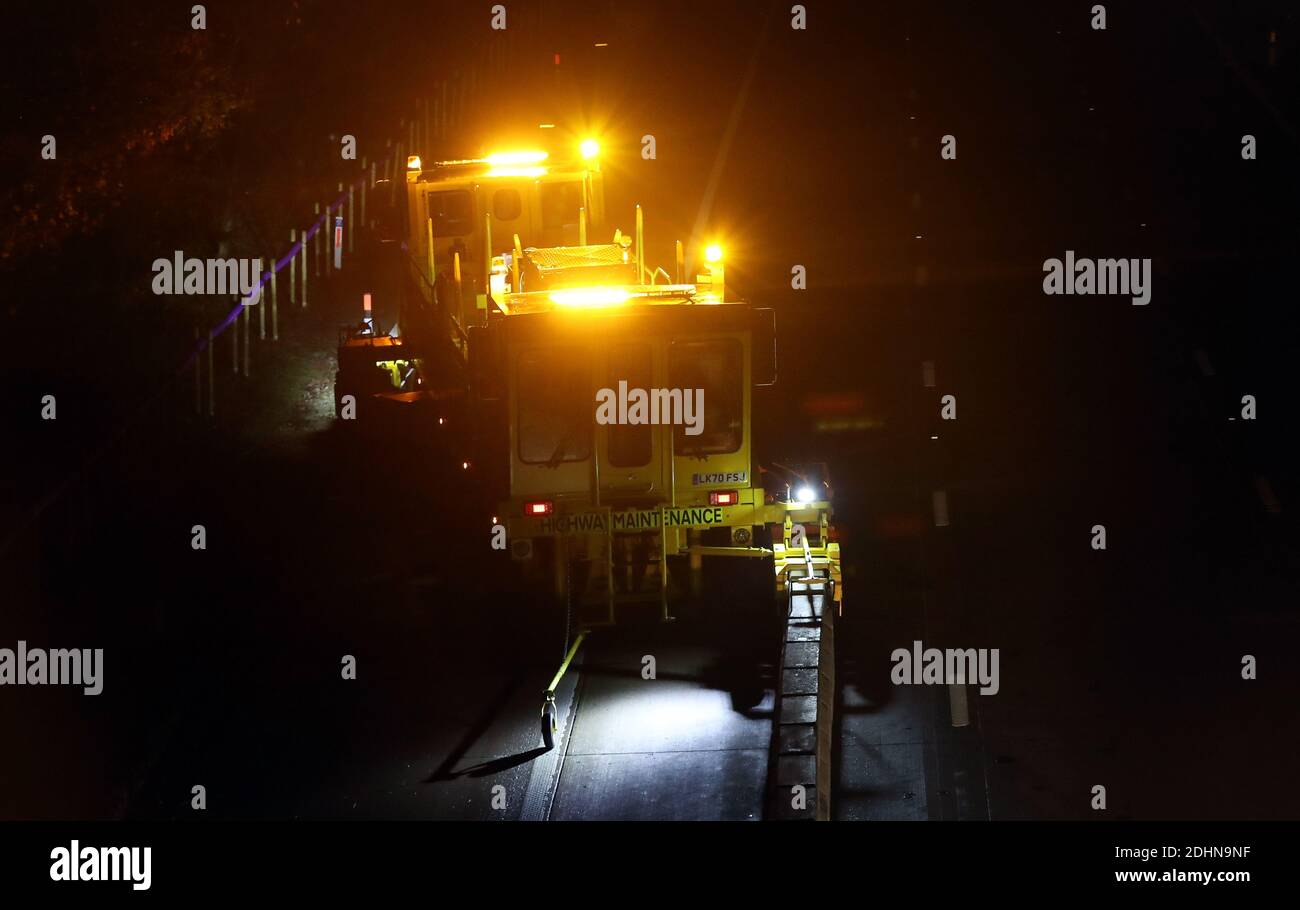 A moveable barrier system is lifted into place on a section of the M20 ...