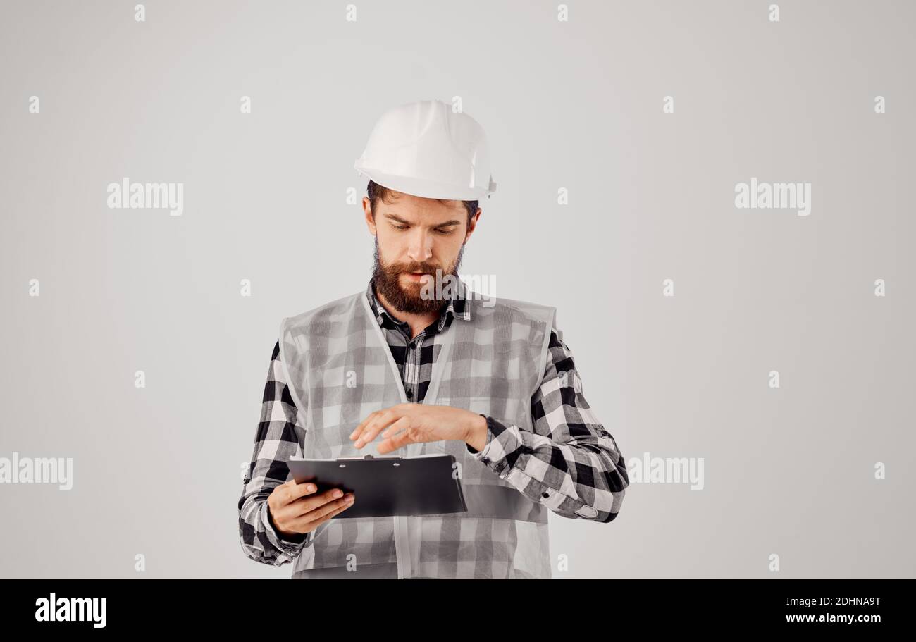Worker man white hard hat documents construction checking work Stock ...