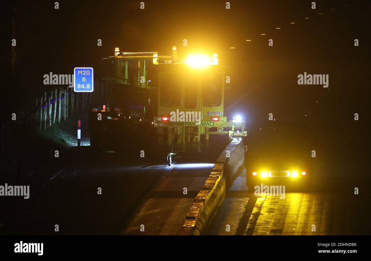A moveable barrier system is lifted into place on a section of the M20 ...