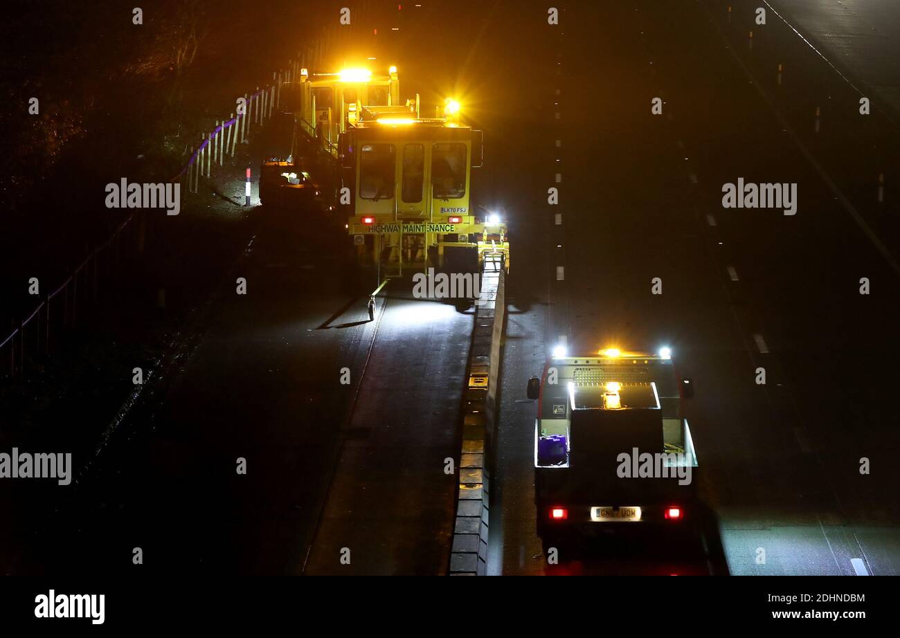 A moveable barrier system is lifted into place on a section of the M20 ...