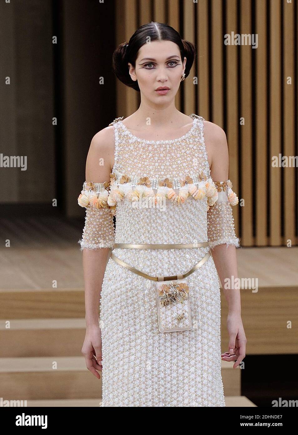 Bella Hadid displays a creation during the Chanel show during Paris ...