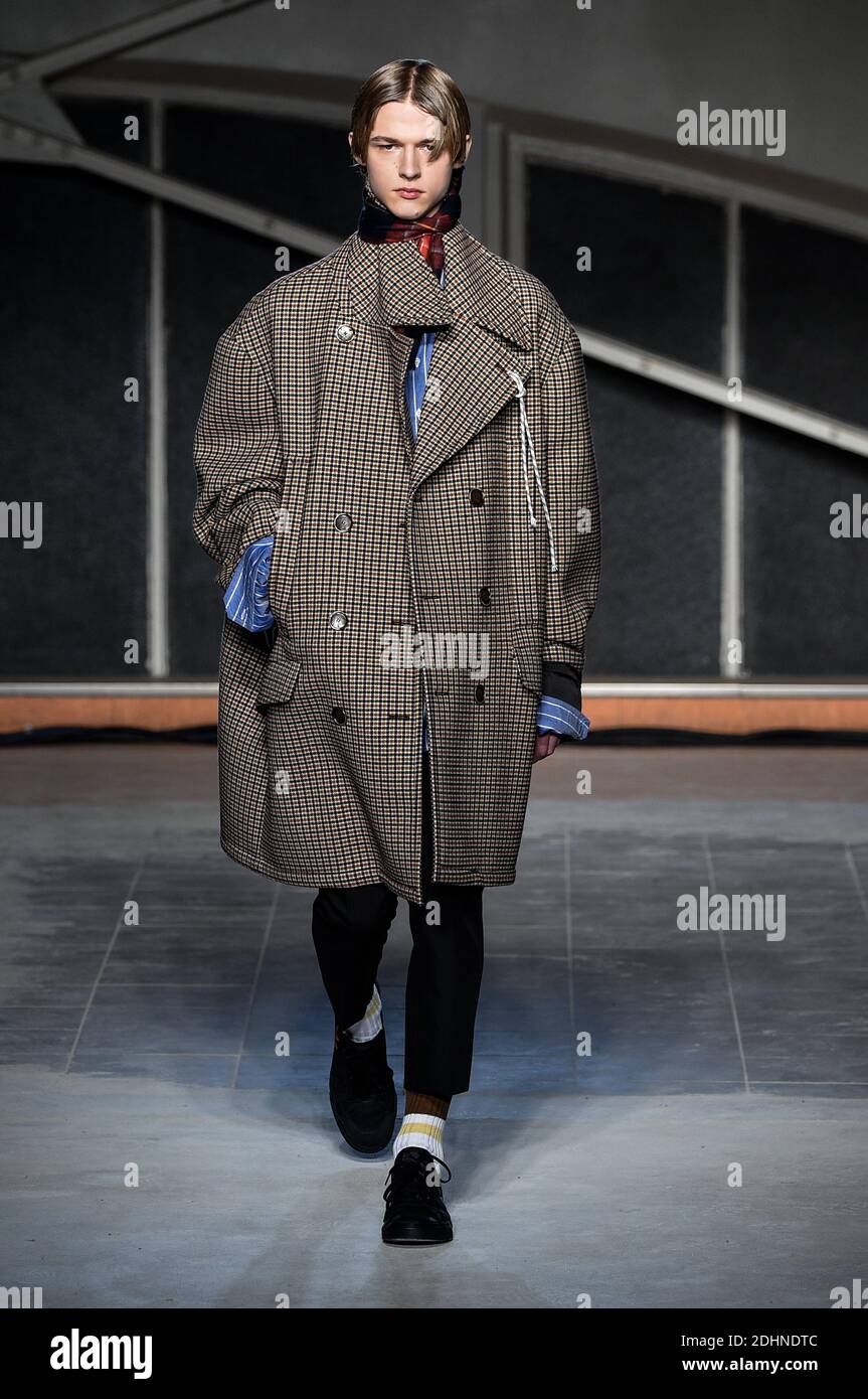 A model walks the runway at the Raf Simons show during Paris Men's ...