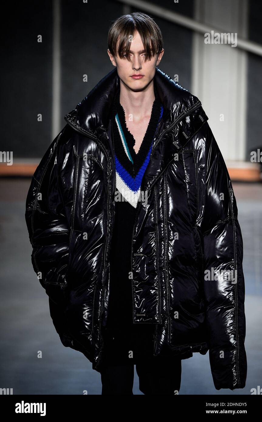 A model walks the runway at the Raf Simons show during Paris Men's ...