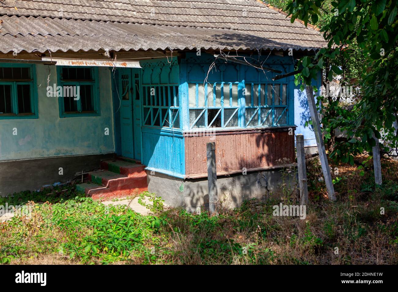 Old Rustic House with Veranda Stock Photo - Alamy