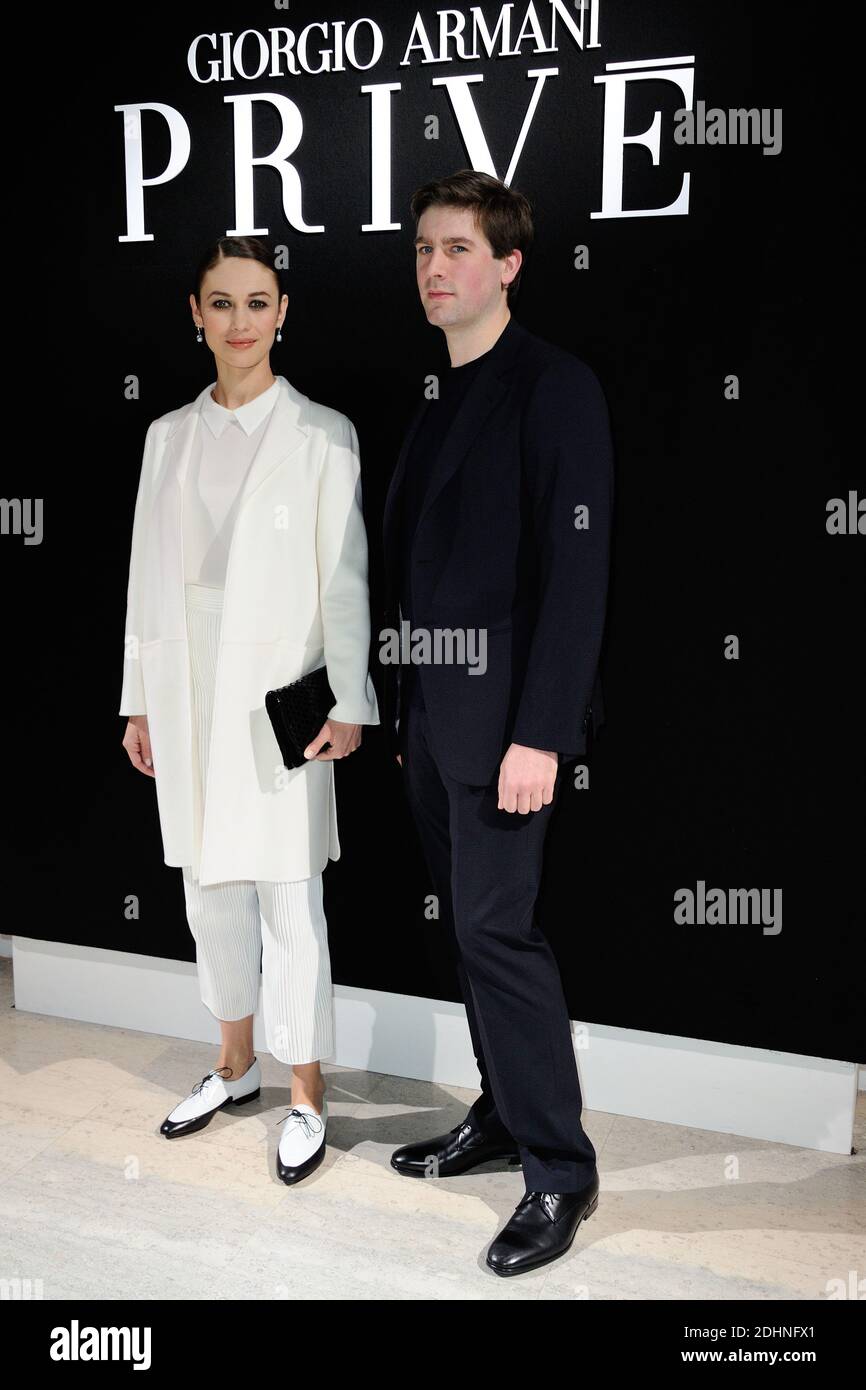 Olga Kurylenko and Max Benitz arrives to the Giorgio Armani Prive show ...