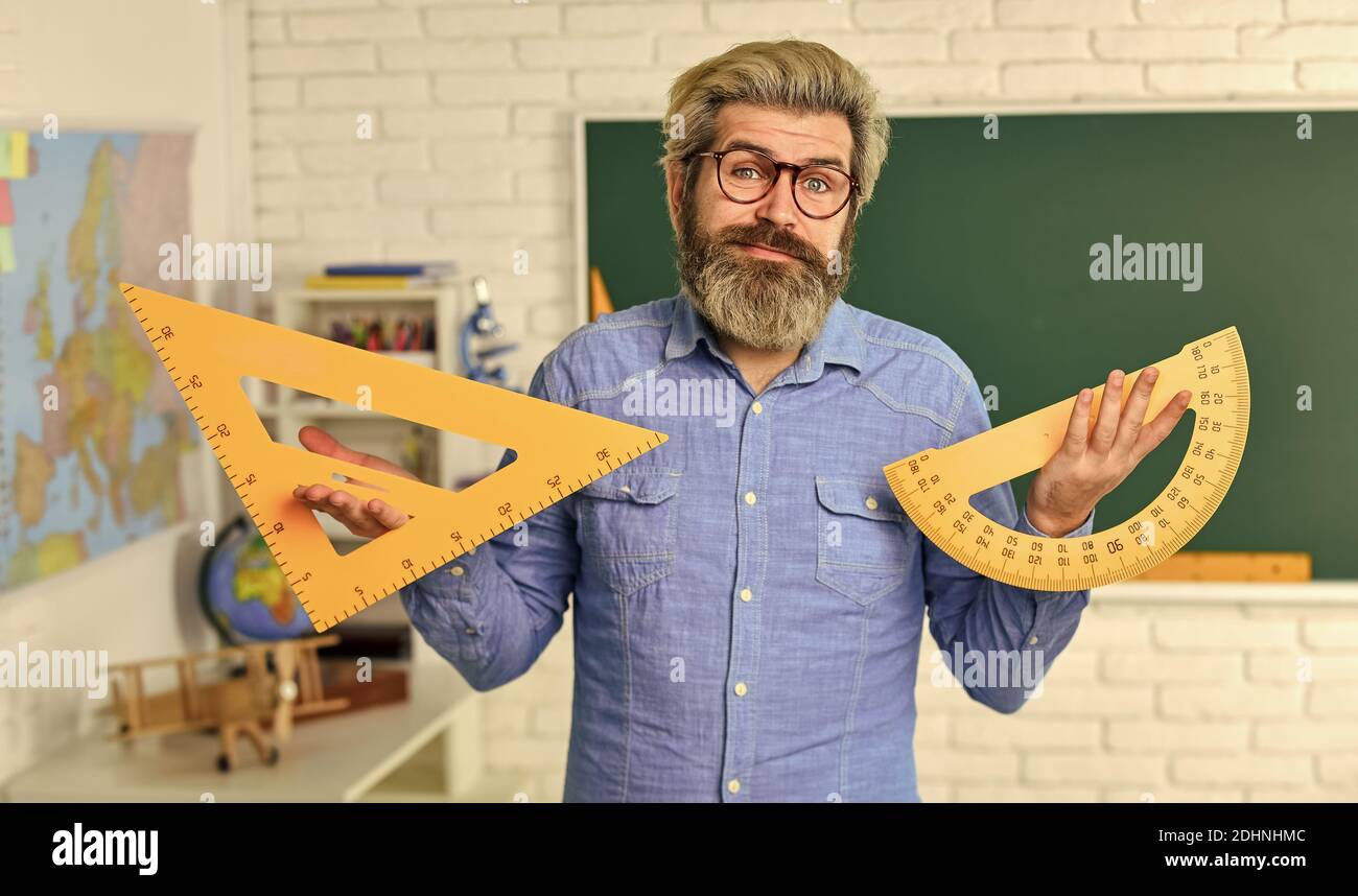 Man mentoring school projects. Math subject. Geometry and algebra ...