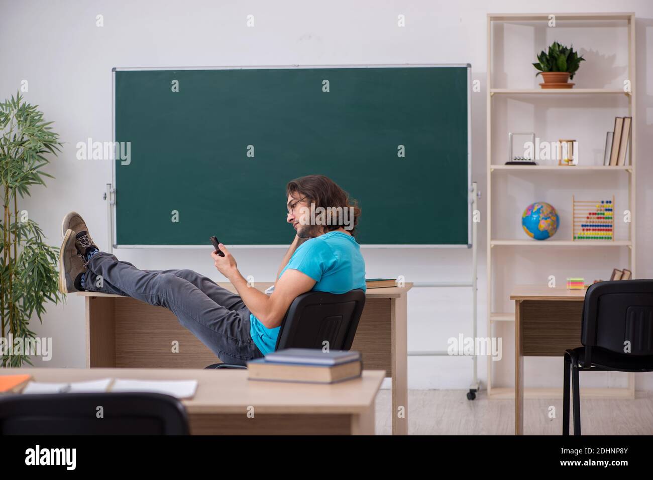 High school student texting in class hi-res stock photography and ...