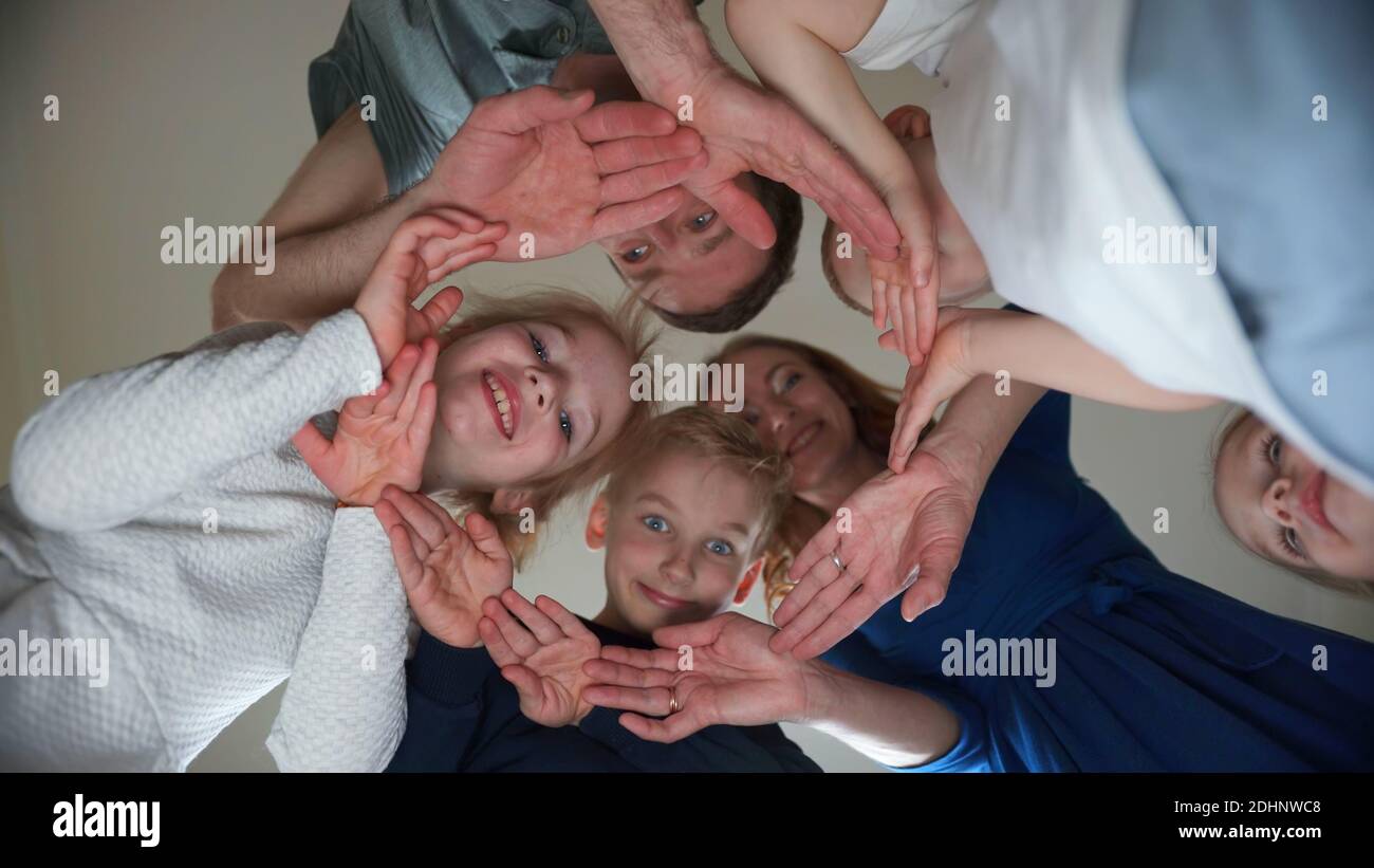 A friendly family makes a circle out of their hands Stock Photo - Alamy