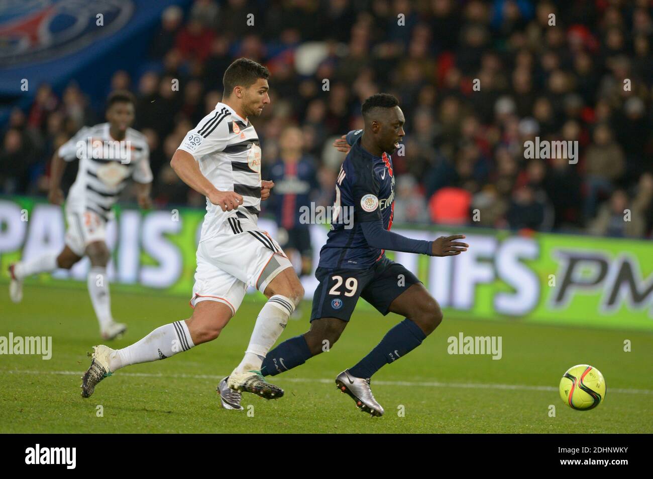 PSG's Jean-Kevin Augustin battling Lorient's Lindsey Rose during the ...
