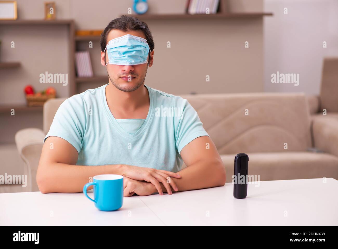 Young man boring at home during pandemic Stock Photo - Alamy