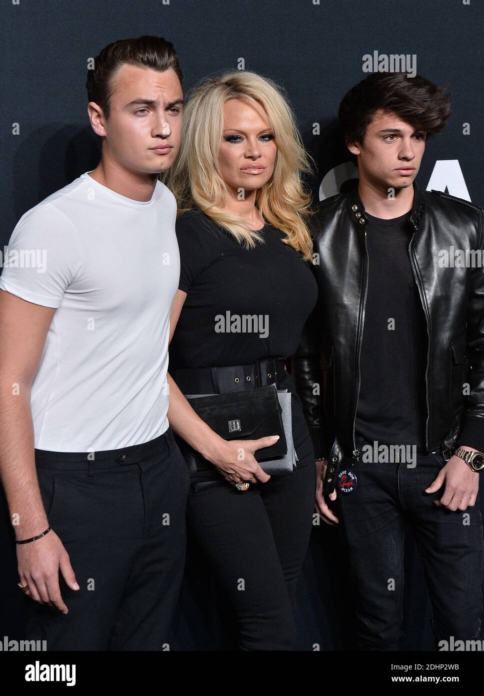 Pamela Anderson and her sons attend the Saint Laurent show at The ...