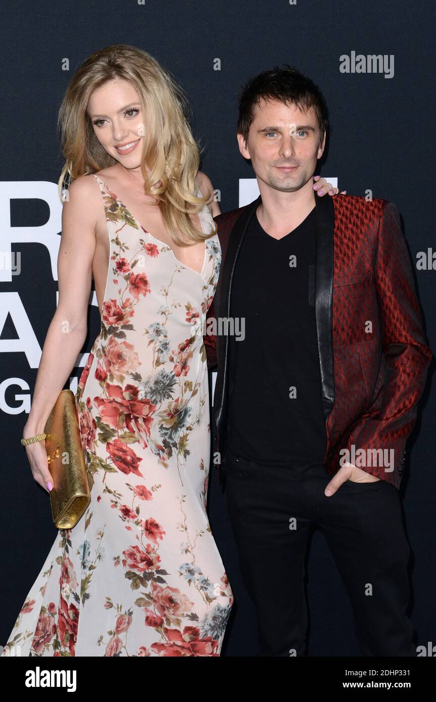 Elle Evans and Matt Bellamy attend the Saint Laurent show at The ...