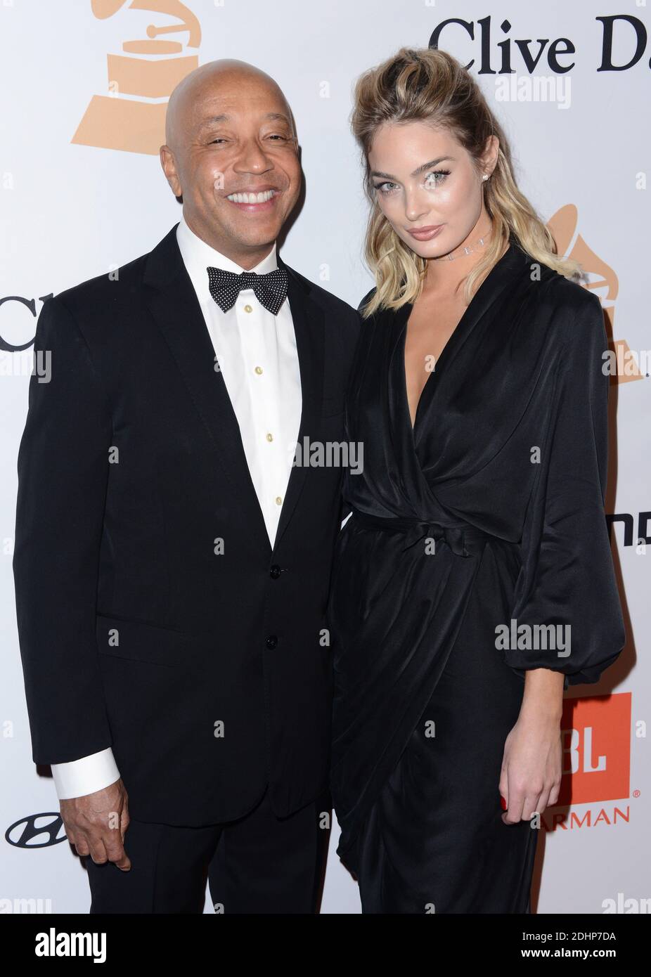 Russell Simmons and Lucy McIntosh attend the 2016 Pre-GRAMMY Gala and ...
