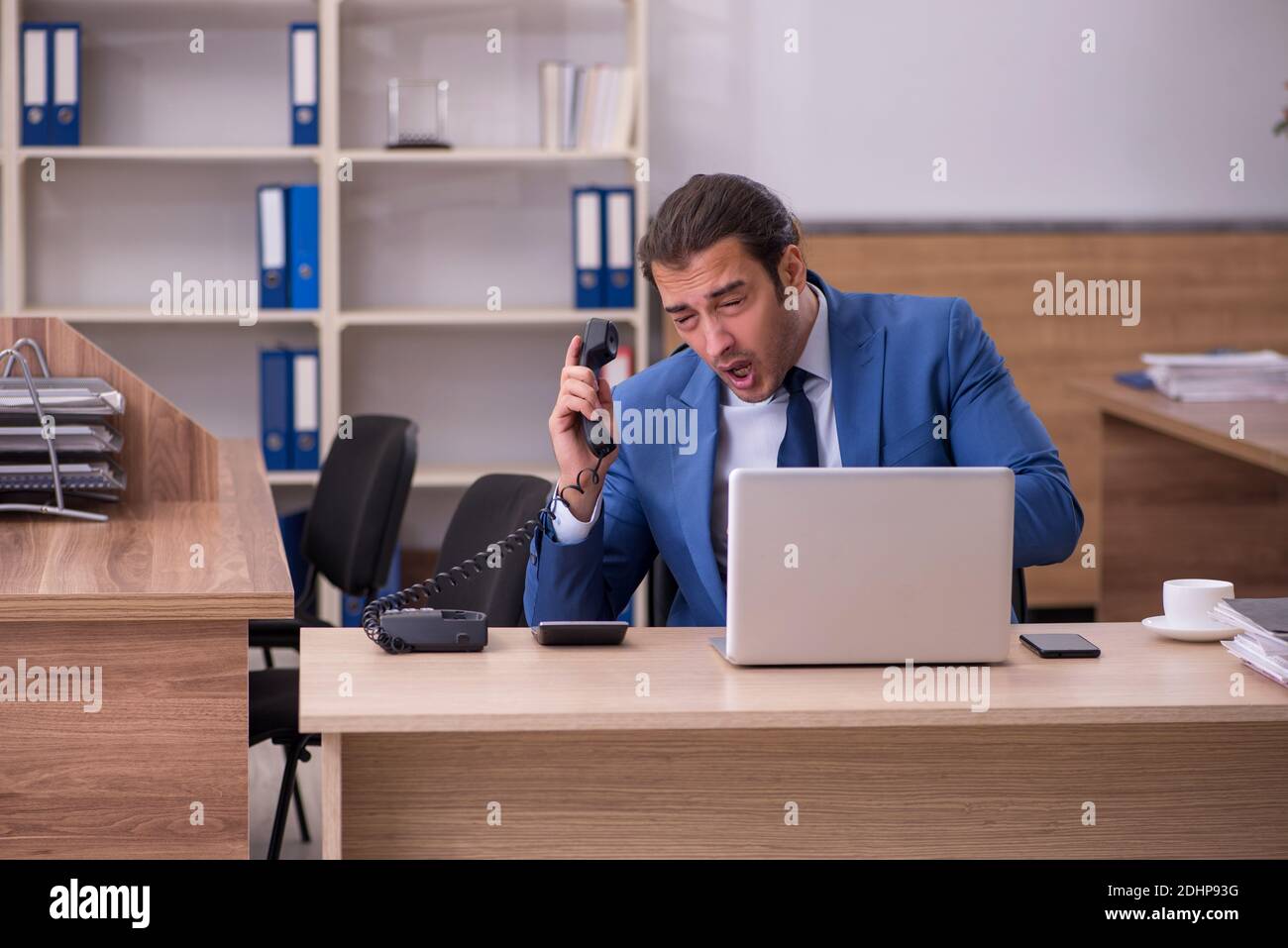 Sick businessman employee suffering at workplace Stock Photo - Alamy