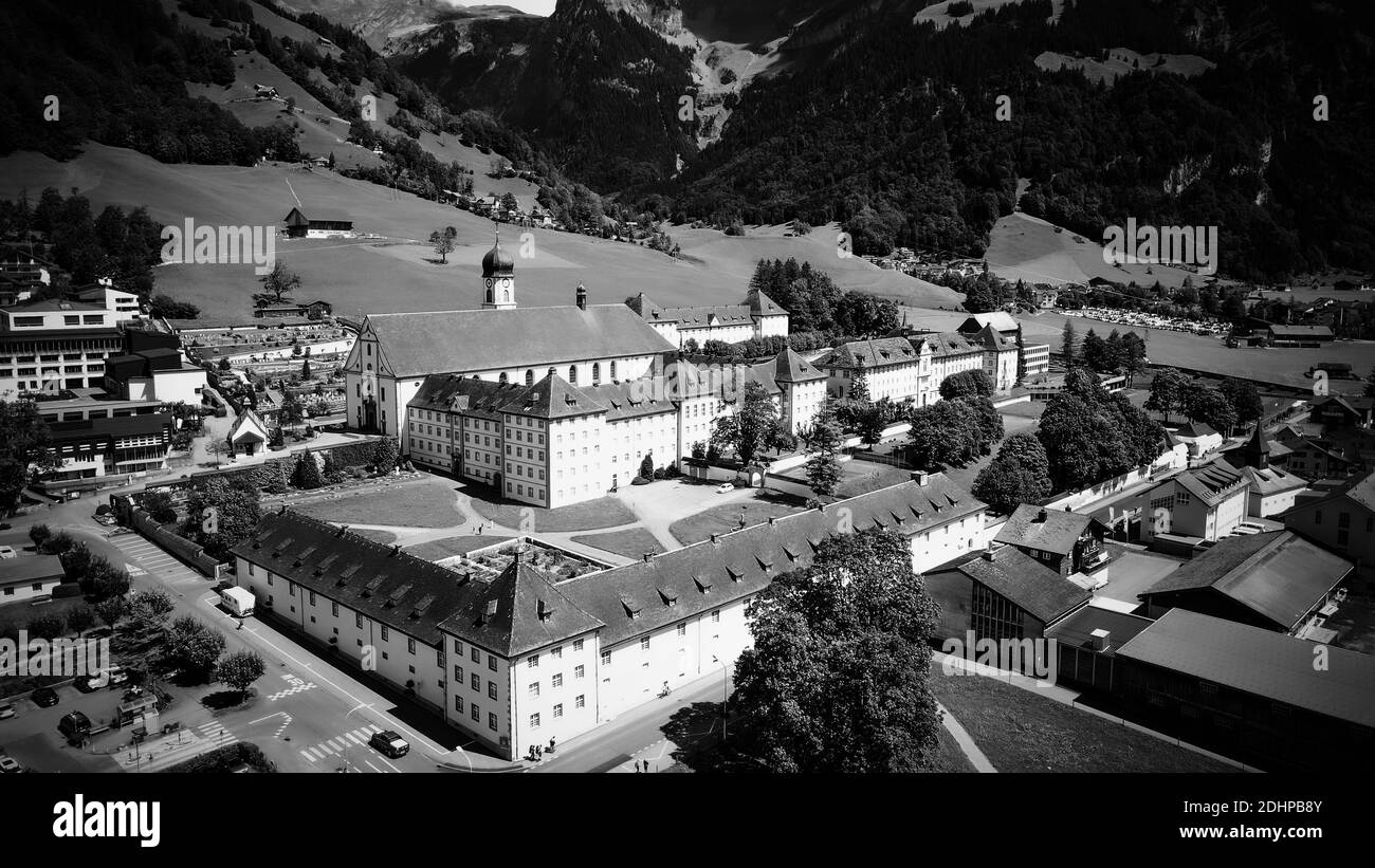 Flight over the city of Engelberg in Switzerland in black and white ...
