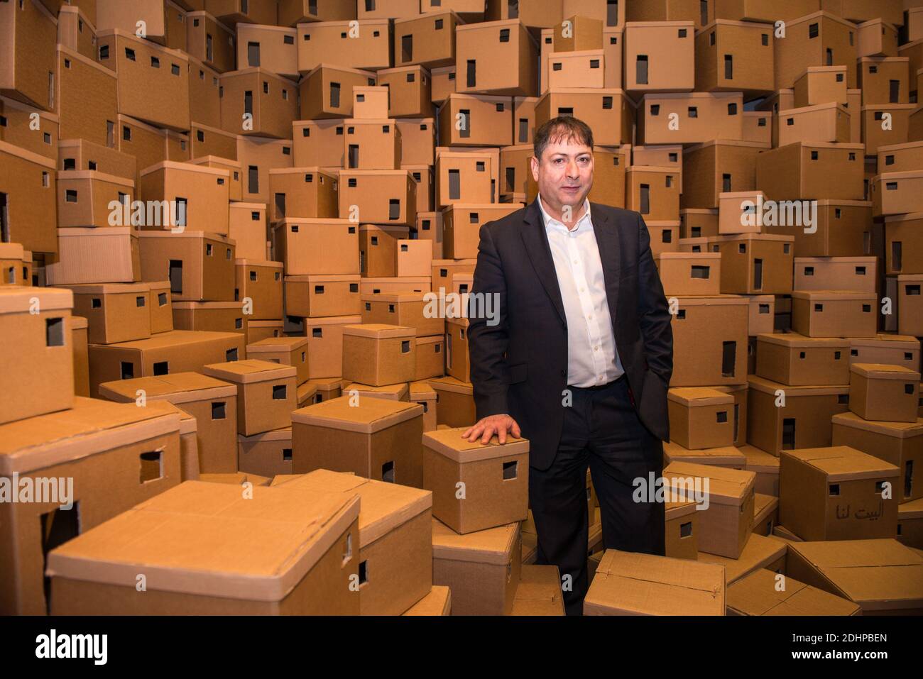 Palestinian artist Bashir Makhoul poses at the expo 'Palestine a l'IMA ...