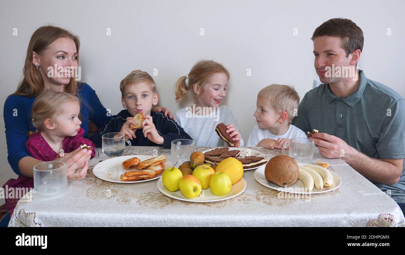A large and friendly family has lunch at home Stock Photo - Alamy