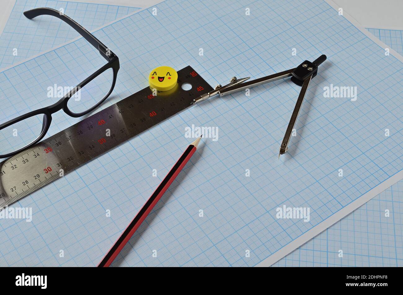 Glasses and objects for drawing on millimeter paper. Compass and ...