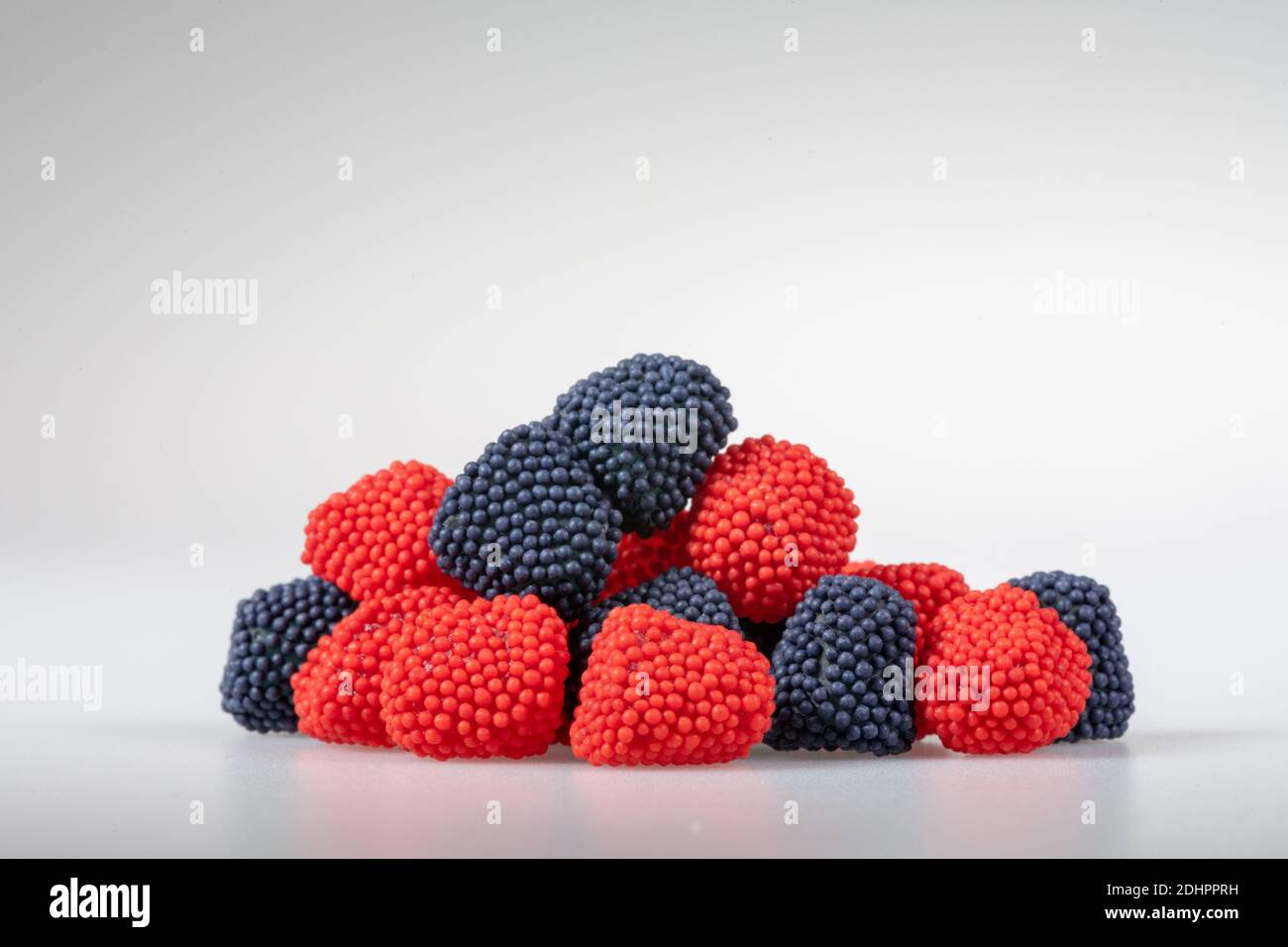 Spread out pile of gummy candies on white background Stock Photo - Alamy