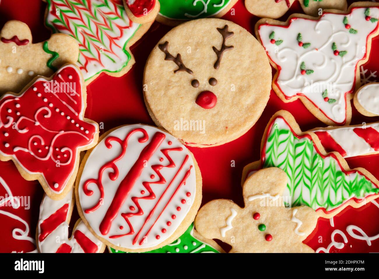 Red plate full of colorfully decorated Christmas cookies - Christmas ...