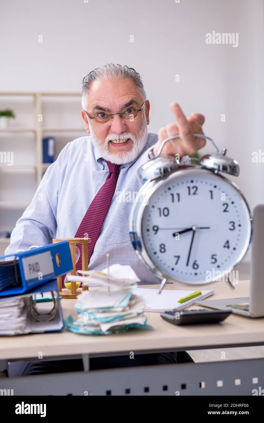 Senior accountant in budget planning concept in the office Stock Photo ...