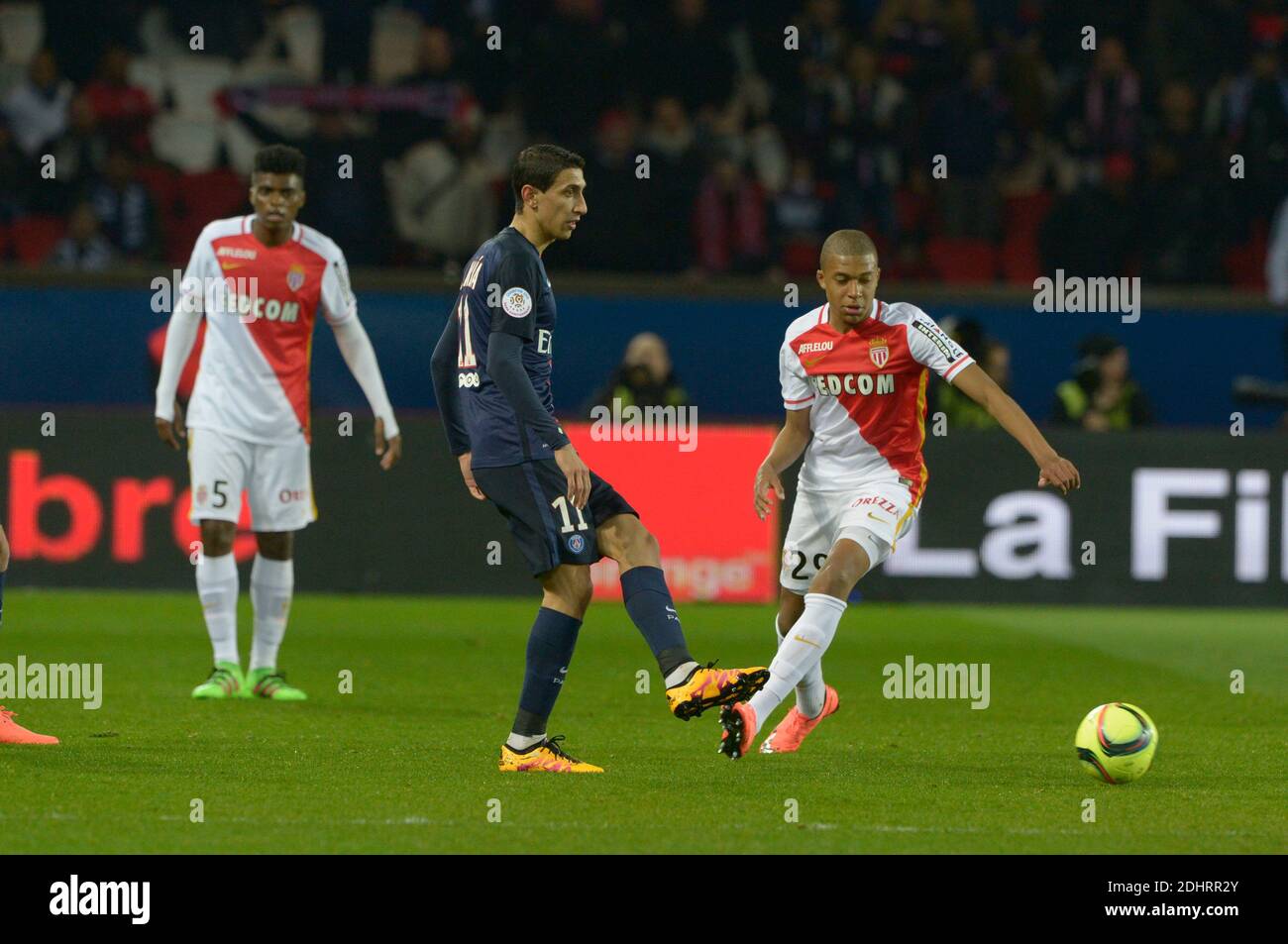 PSG's Angel Di Maria battling Monaco's Kylian Mbappe during the French ...