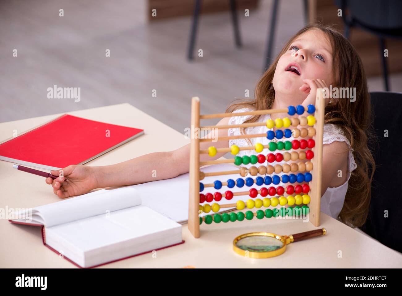 Little girl preparing for exams at home Stock Photo - Alamy