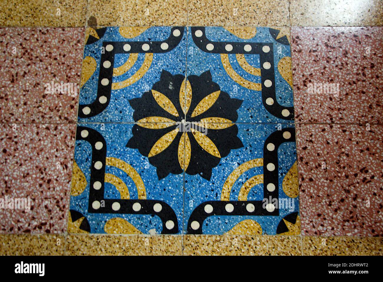 View of geometrical patterns in colour, grained mosaic floor tile ...