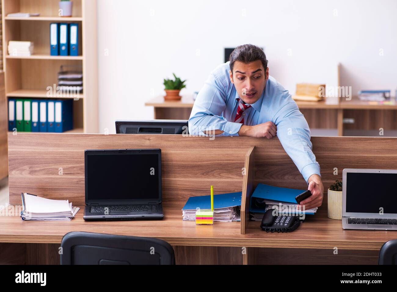 Male employee in industrial espionage concept Stock Photo - Alamy