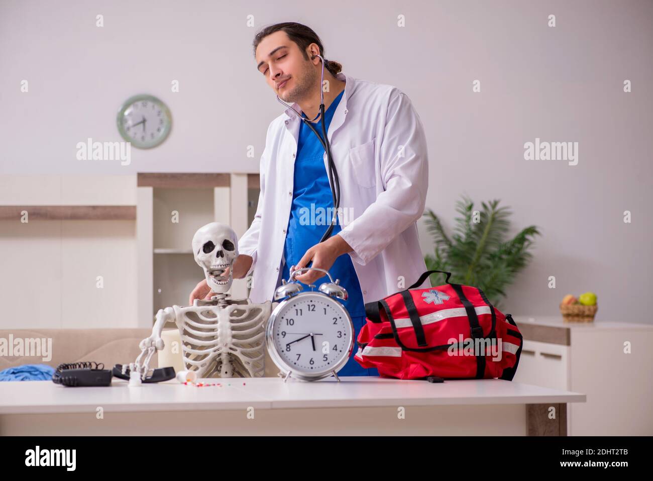 Male paramedic visiting skeleton patient Stock Photo - Alamy