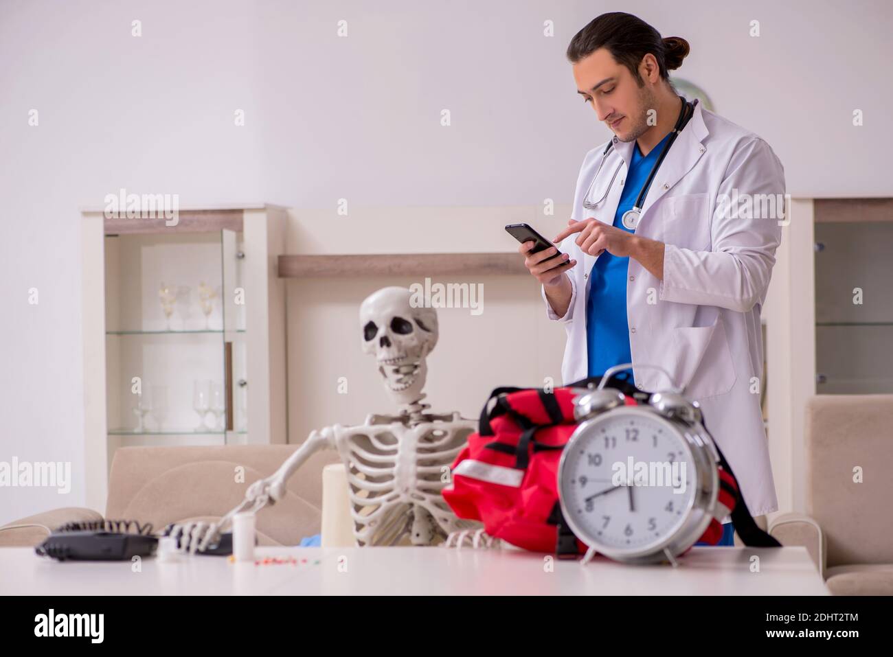Male paramedic visiting skeleton patient Stock Photo - Alamy