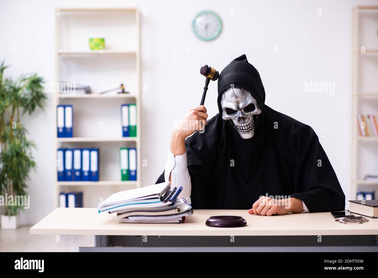 Devil judge working in the courthouse Stock Photo - Alamy