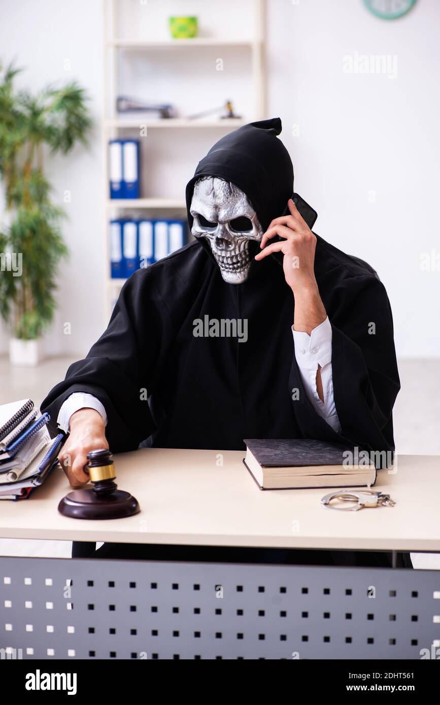 Devil judge working in the courthouse Stock Photo - Alamy