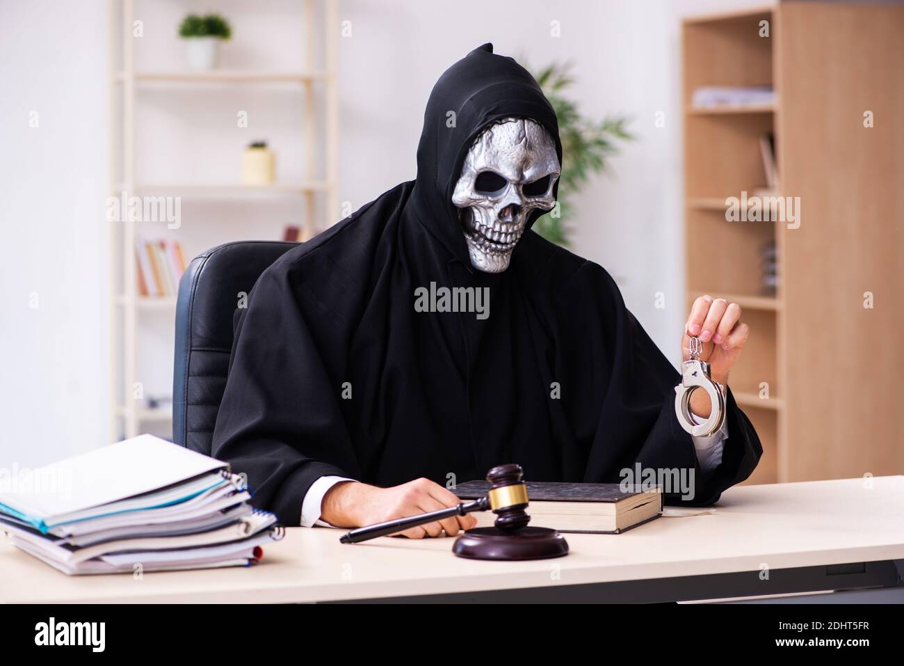 Devil judge working in the courthouse Stock Photo - Alamy