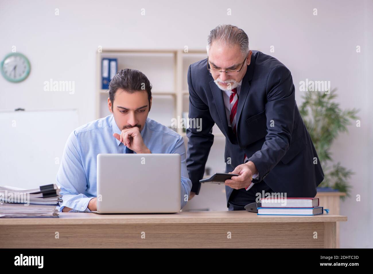 Two employees in the office environment Stock Photo - Alamy