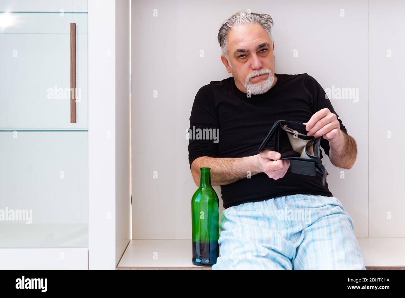 Old man in depression mode at home Stock Photo - Alamy