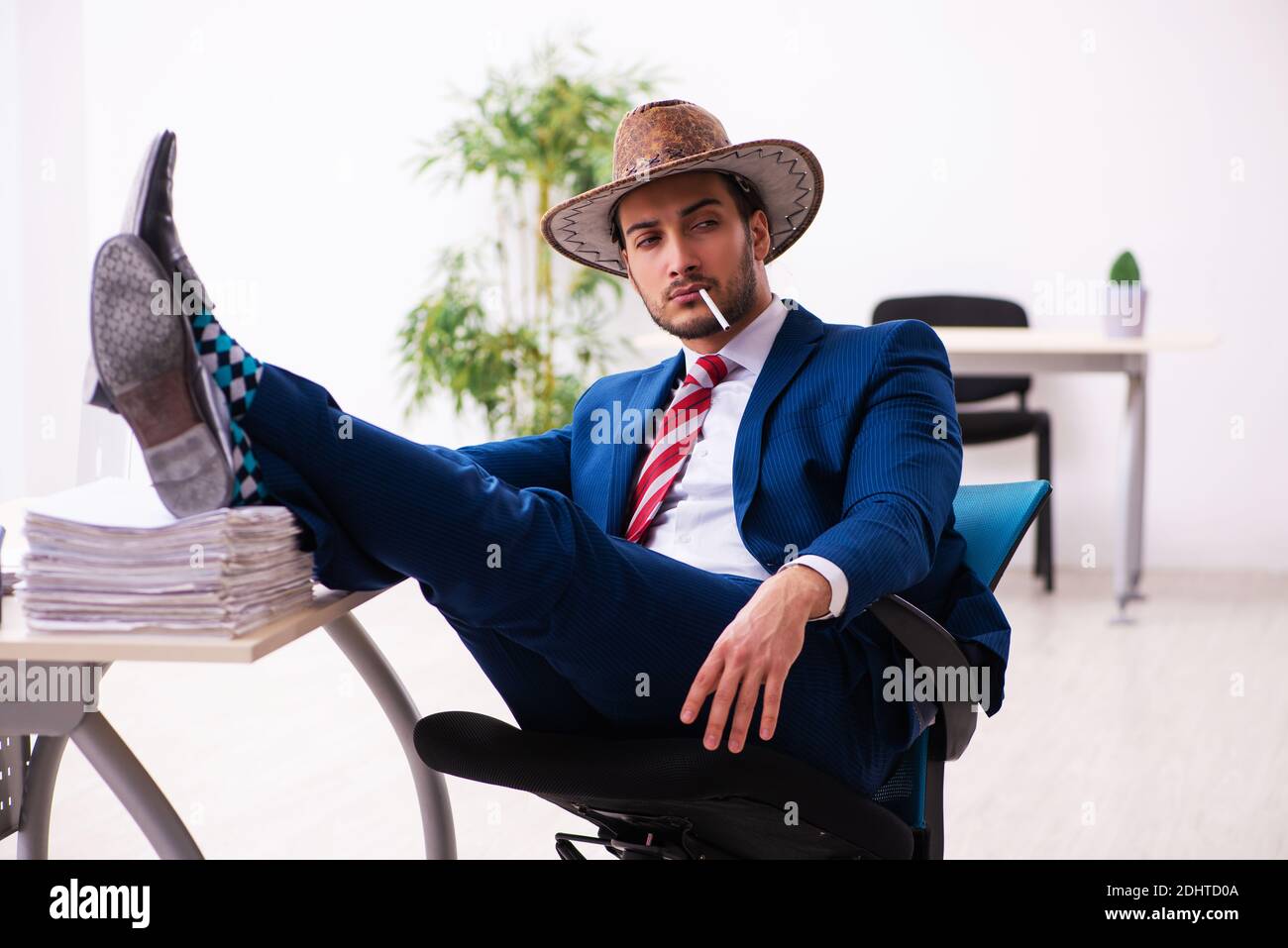 Young cowboy smoking cigarette hi-res stock photography and images - Alamy